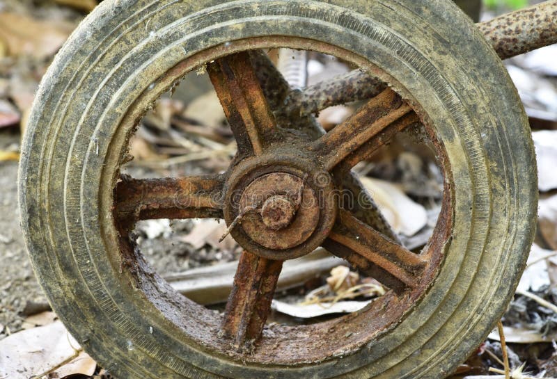 Old rusty steel cart wheel stock photo. Image of rust - 254454548