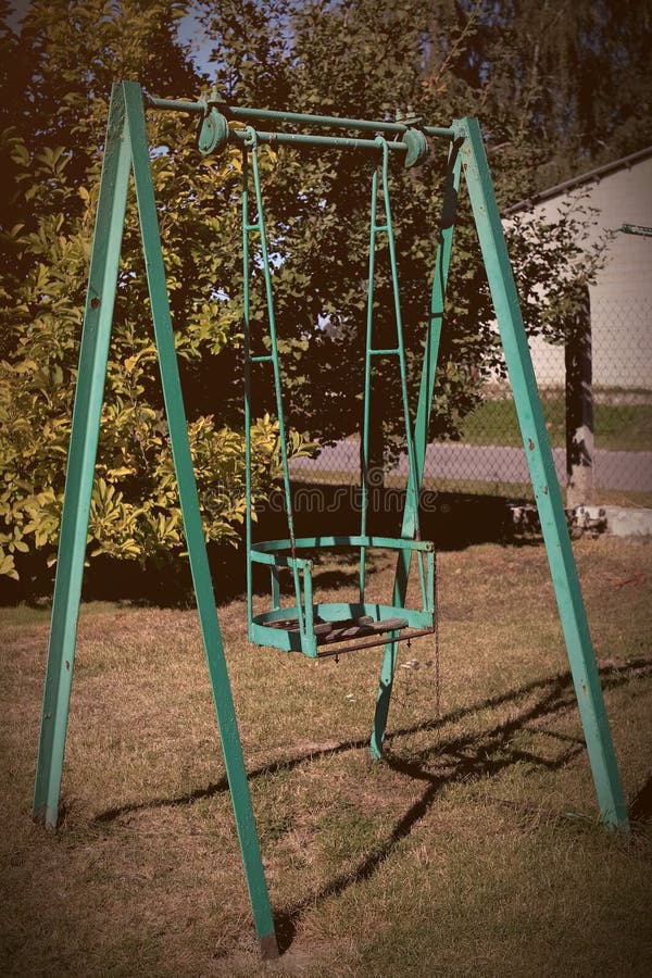 A Metal Swing from the Early 1980s. Stock Photo - Image of lawn ...