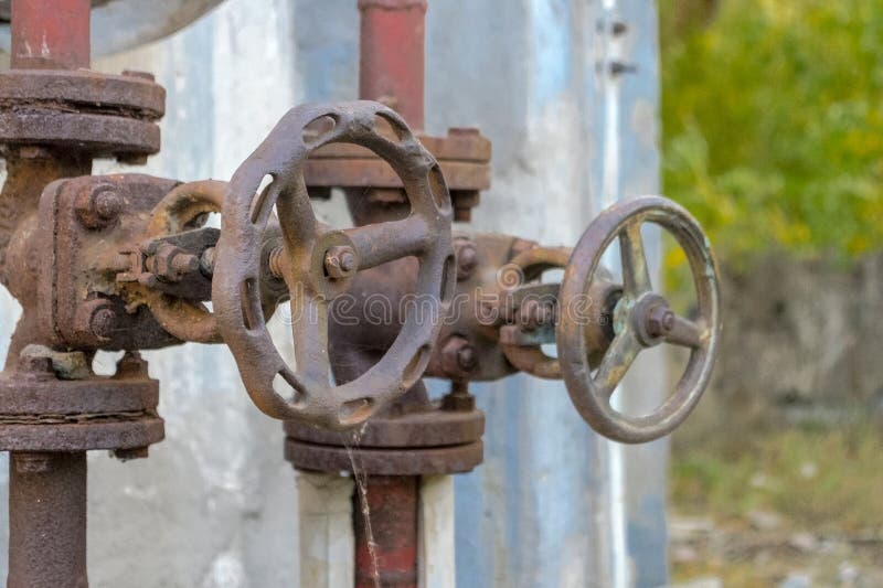Old Rusty Steel Valve Knobs on the Wall of a Historic Water Tower ...