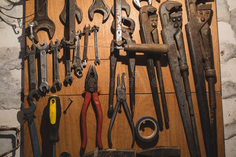 Old Rusty Tools Hang on the Wall Stock Photo - Image of iron, hammer ...