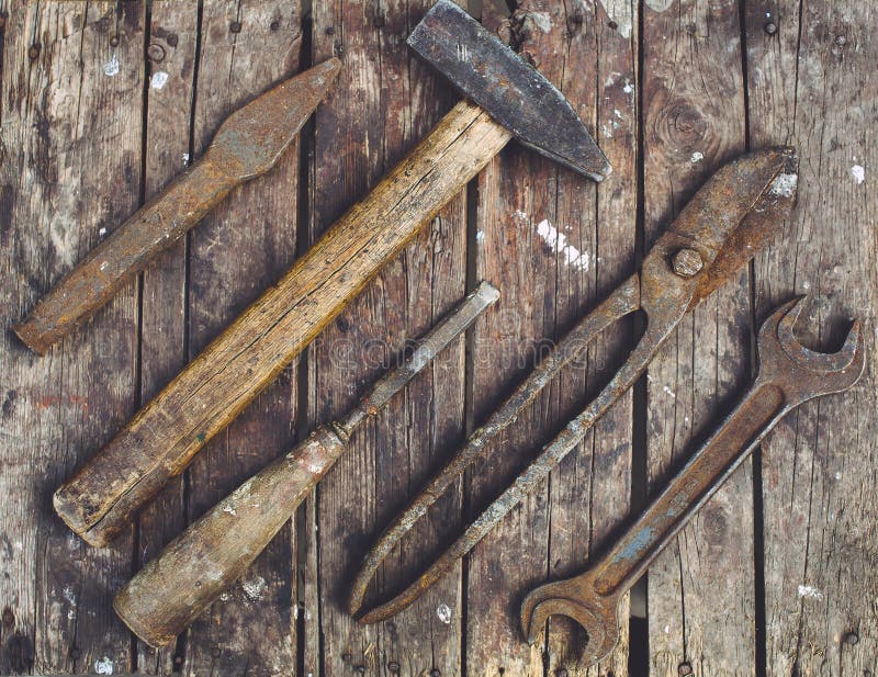 Old, Rusty Tools Lying on a Wooden Table. Stock Photo - Image of brown ...