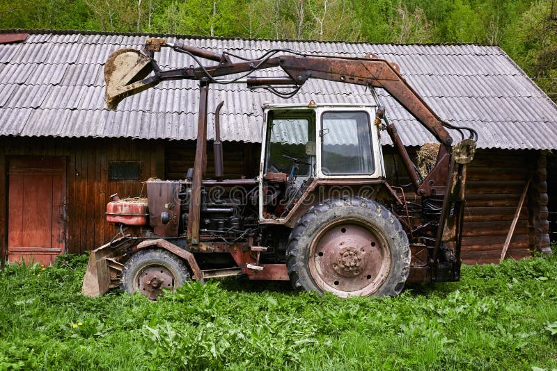 Old Rusty Tractor with Dragging Bucket Stock Photo - Image of season ...