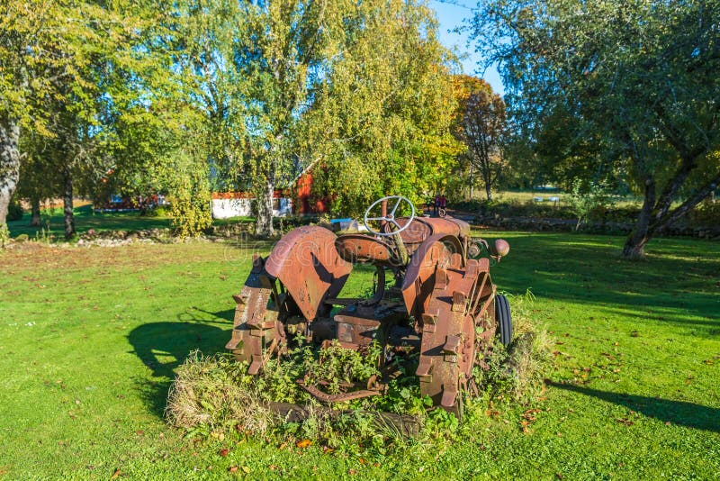 Old Rusty Tractor in a Garden Stock Image - Image of agriculture ...