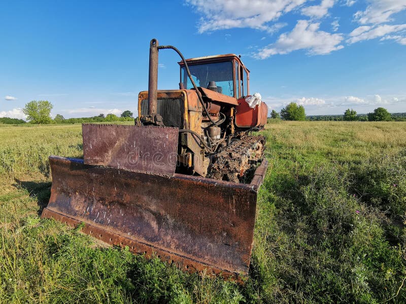Old Rusty Tractor on Tracks. Old Farm Equipment Stock Image - Image of ...