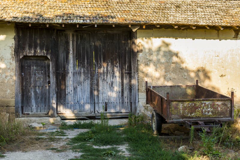 Old and Rusty Trailer in Front of a Abandoned Farm. Stock Photo - Image ...