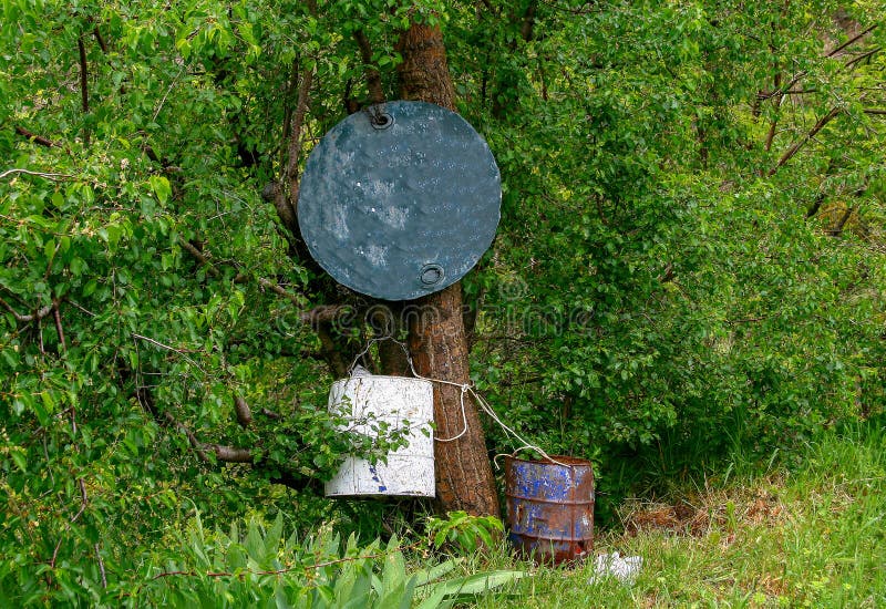 Old and Rusty Trash Containers for Garbage. Trash Bin Along the Stock ...
