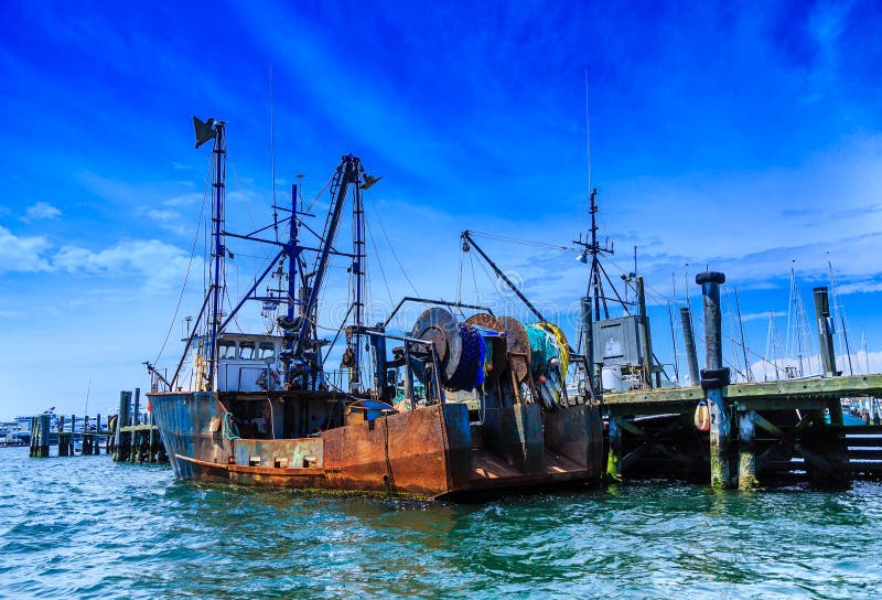Old rusty trawler at dock stock photo. Image of yachts - 104510430