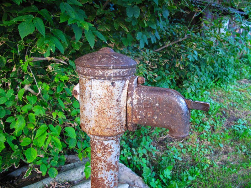 Old Rusty Water Pump in the Village Stock Photo - Image of iron, rural ...