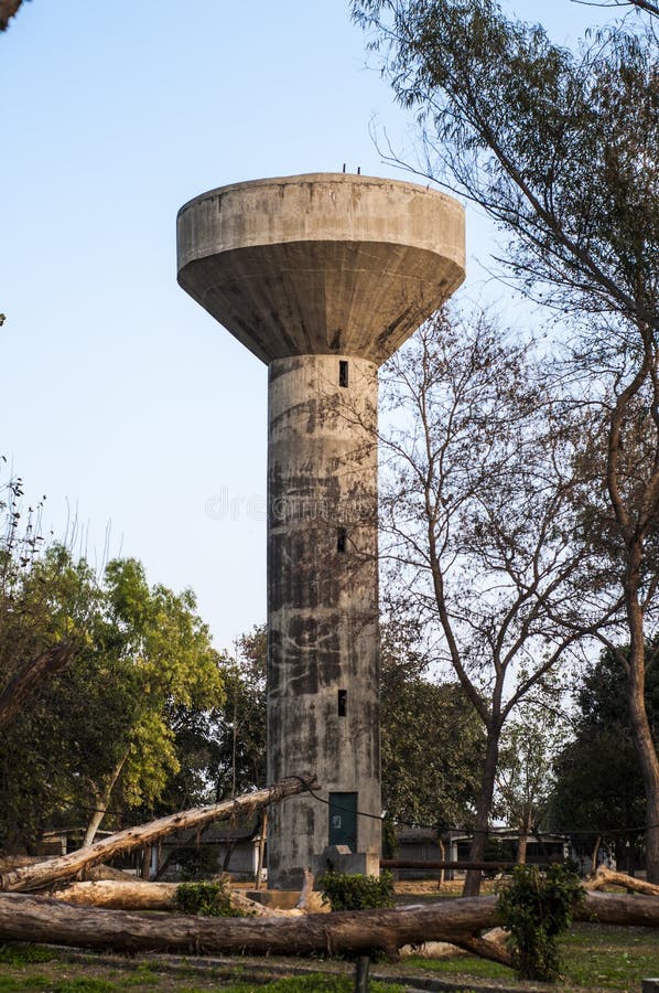 An Old and Rusty Water Tank in the Forest Stock Image - Image of ...