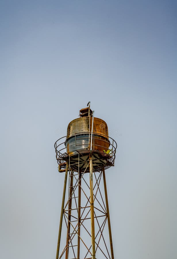 Yellow water tank tower stock photo. Image of object - 92543588
