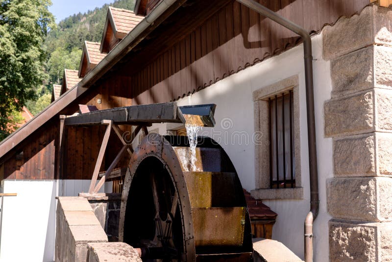 Old Rusty Water Wheel of the Restored Mill Stock Photo - Image of ...