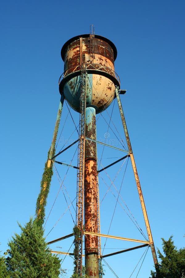 Old Rusty Watertower Against Blue Sky Stock Image - Image of blue ...