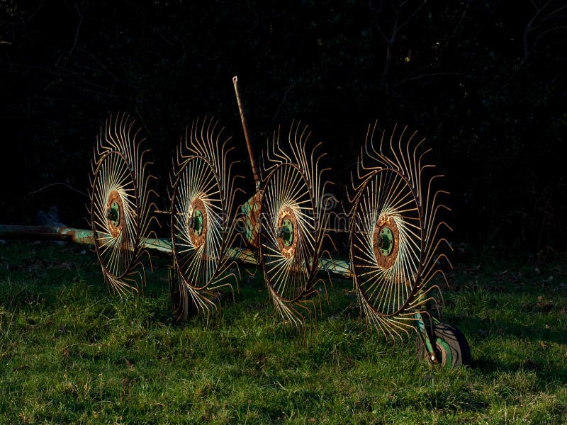 Old Rusty Wheel Rake or Cart Rake in the Field Stock Photo - Image of ...