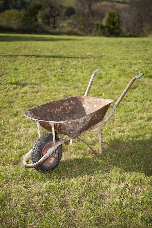 Old Rusty Wheelbarrow Cart in the Garden Stock Image - Image of handle ...