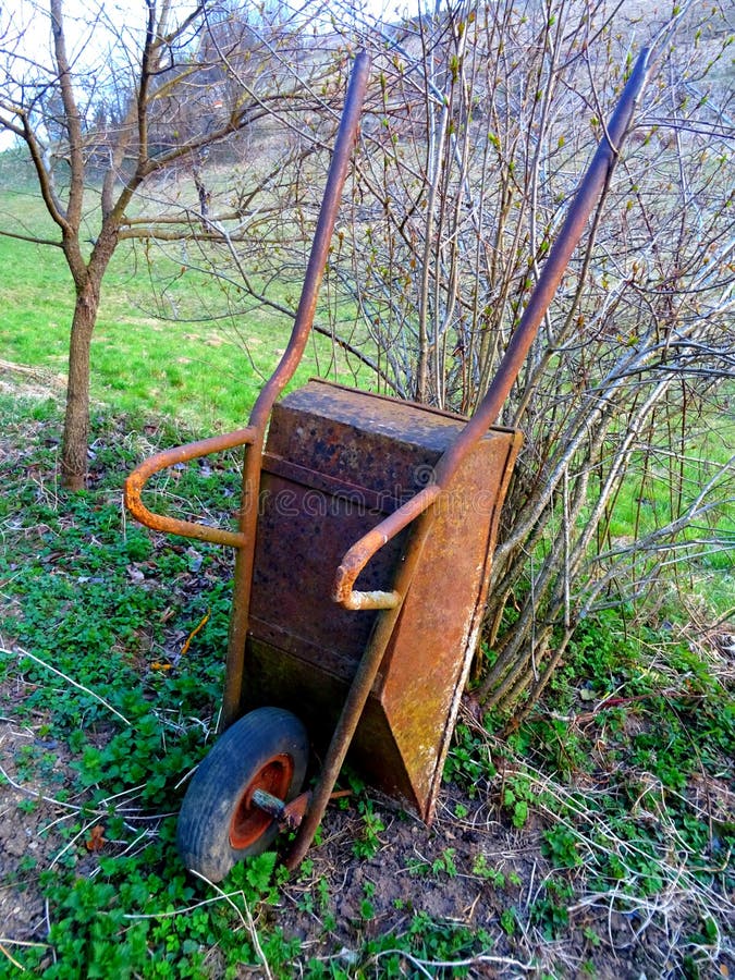 Rusty Old Wheelbarrow stock photo. Image of rusty, handbarrow - 11321730
