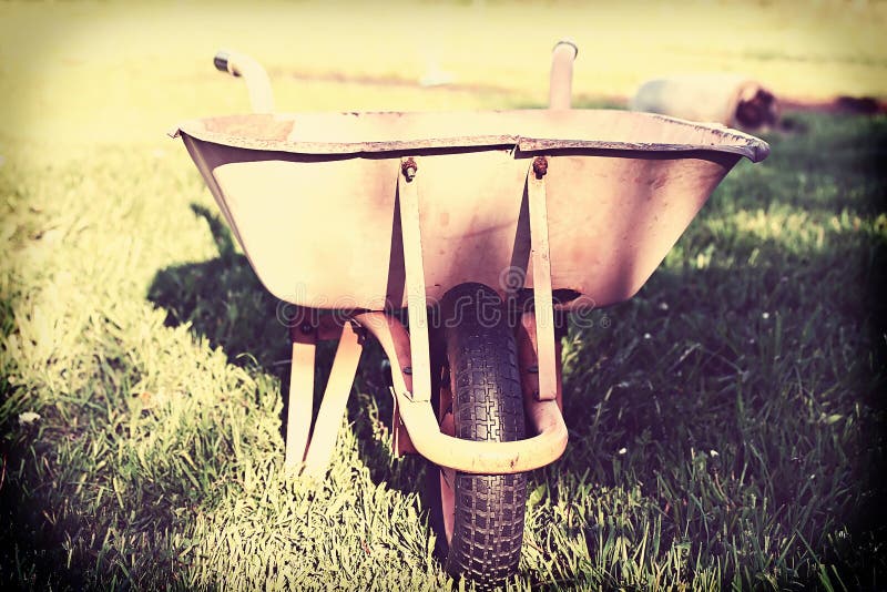 Rusty Red Wheelbarrow With Soil Stock Image - Image of metallic, tire ...