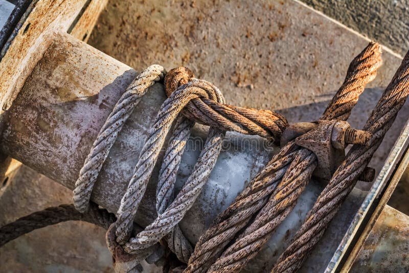 Old Rusty Winch with Corroded Steel Cable Coil and Clamps Detail Stock ...