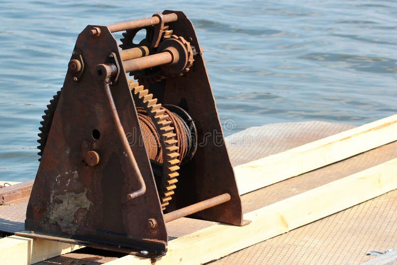 Old rusty winch on a pier stock image. Image of mechanism - 144404731