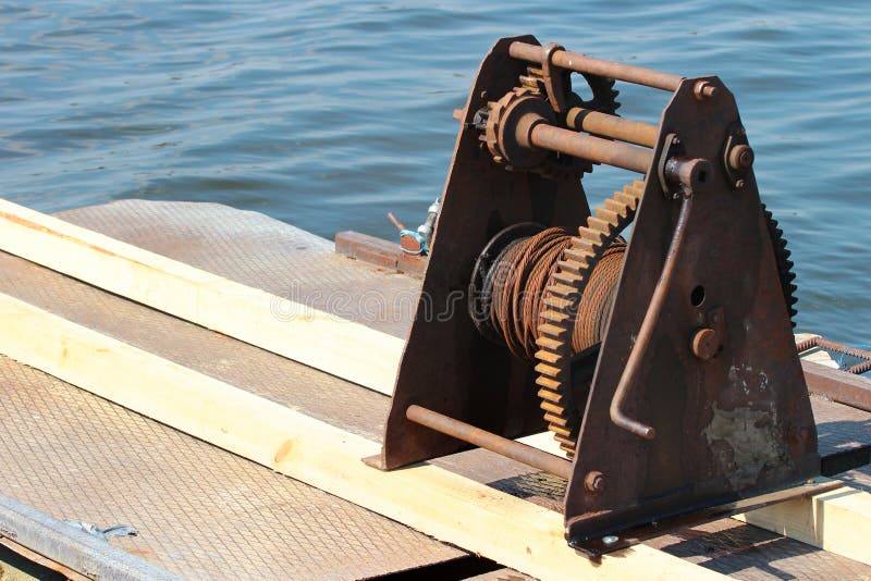 Old rusty winch on a pier stock photo. Image of harbor - 144404804