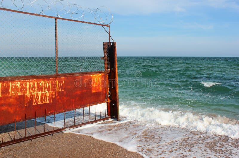 Old Rusty Wire Fence on a Seashore. Restricted Area on a Beach Stock ...