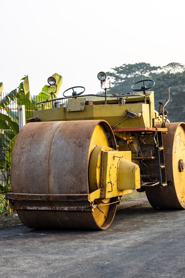 Old Rusty Yellow Road Roller on a Newly Constructed Road Stock Image ...