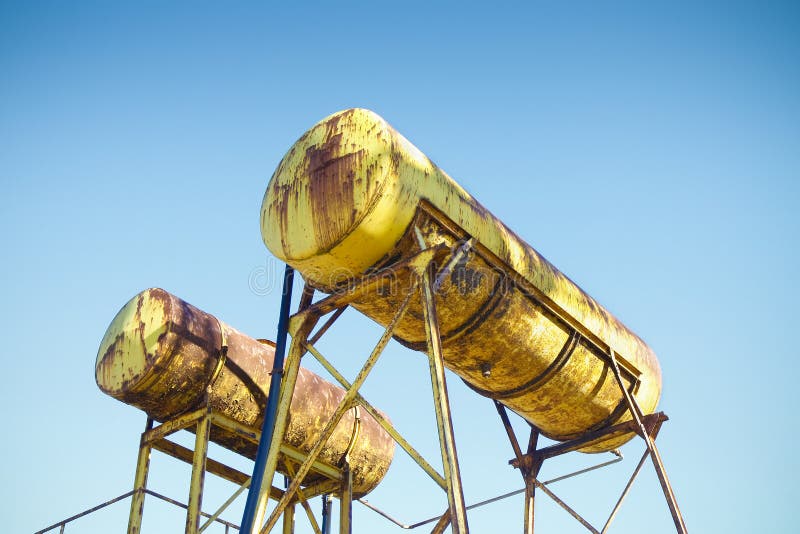 Old Rusty Yellow Tank of an Abandoned Factory Stock Image - Image of ...