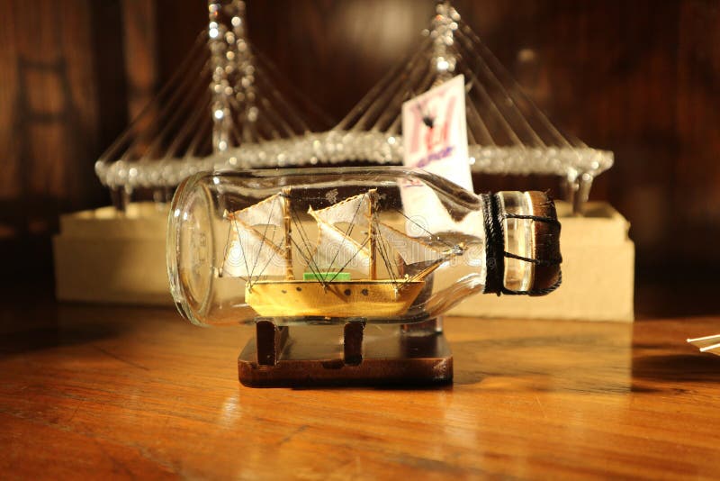 Old Sailboat in Glass Bottle. Small Ship Model Made of Wood Stock Photo ...