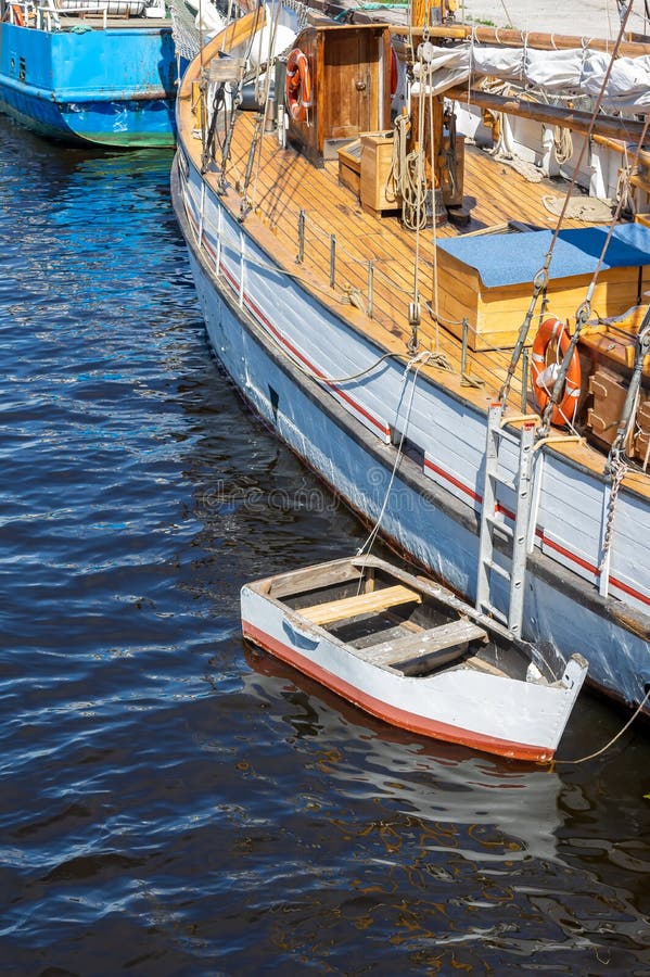 Old Sailing Boat in the Port with Small Rowing Boat Stock Image - Image ...