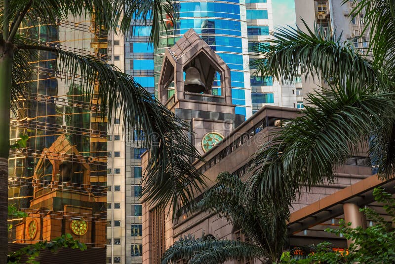 An Old Sandstone Building with a Bell Tower is Reflected in the Windows ...