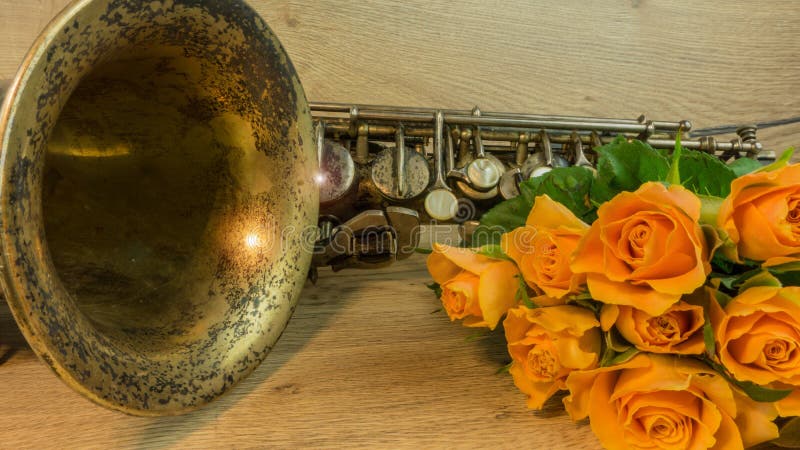 Old saxophone with roses stock image. Image of piano - 88805441