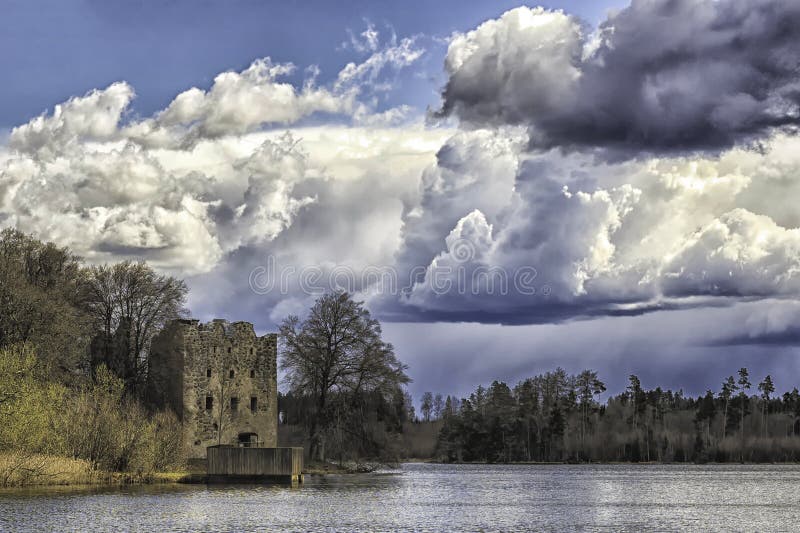 Old Scandinavian Castle on the Lake with Rainy Clouds Editorial ...