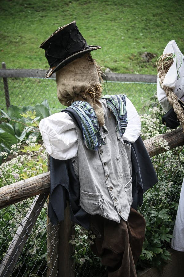 Old Scarecrow in Wood Fence Stock Photo - Image of dressed, outdoors ...
