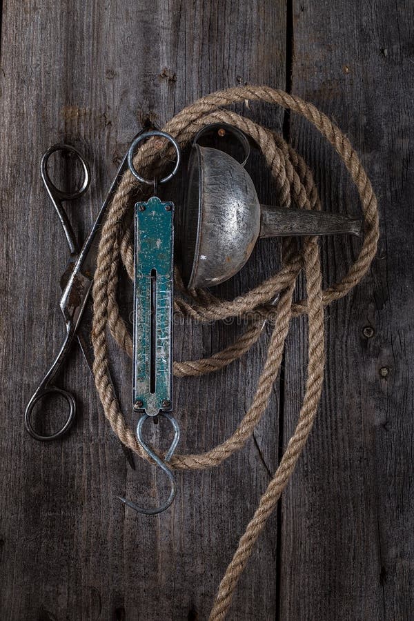 Old Scissors and Rope Hanging on a Wooden Wall Stock Image - Image of ...