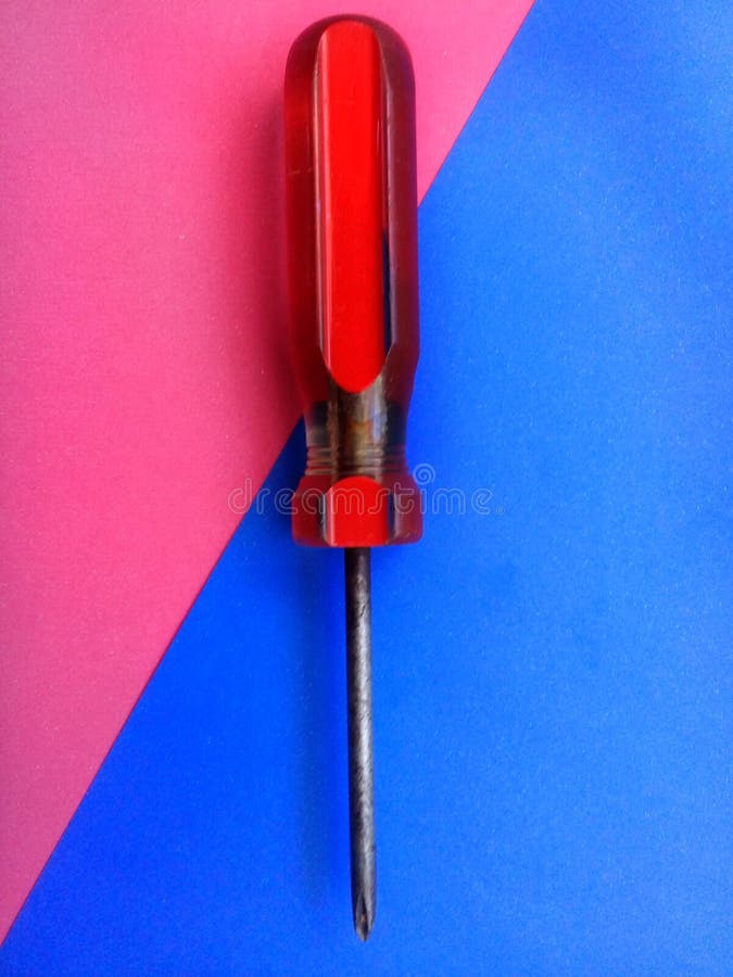 Old Screwdriver with Red Handle and Colorful Background Stock Image ...
