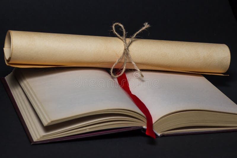 The Old Scroll Lies on the Open Book. Education Concept. Ancient ...