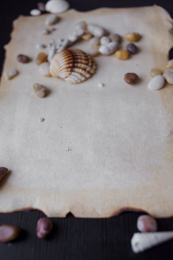 Old Scroll of Parchment with Sea Pebbles and Stock Photo - Image of ...