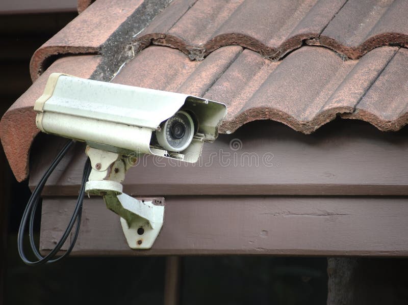 Old Security Camera or CCTV Installed on the House Roof. Stock Image ... Old Security Camera or CCTV Installed on the House Roof. Stock Image ...