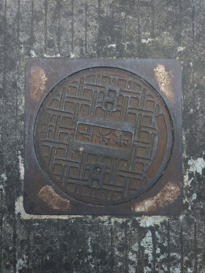 Old Sewer Cover with Japanese Characters Written on it Stock Photo ...