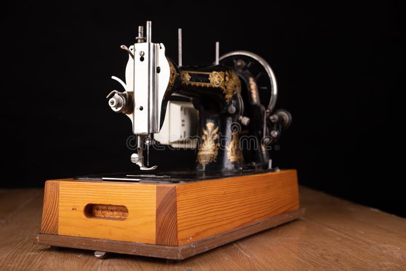 Old Sewing Machine on a Dark Table. an Antique Device for Small ...