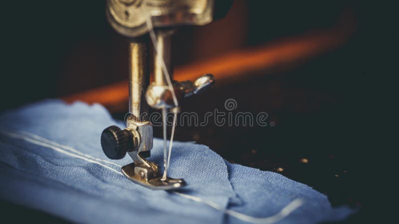 Old Sewing Machine, the Man Who Sews on it, in Dark Colors Stock Photo ...
