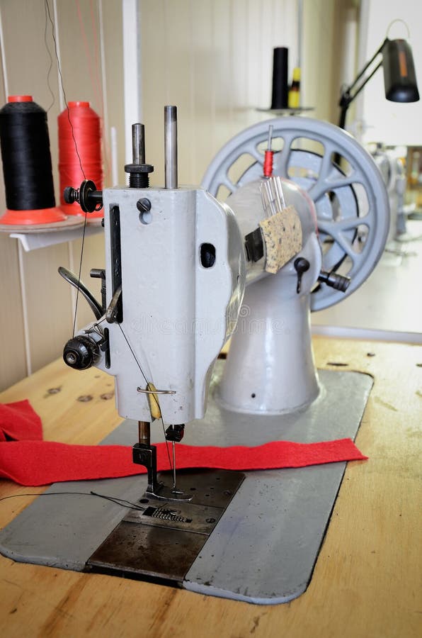 Old Sewing Machine in the Sewing Studio. Vertical Stock Image - Image ...
