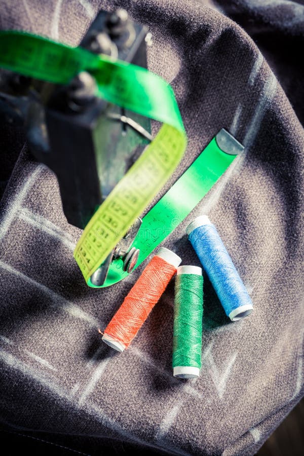 Old Sewing Machine with Threads, Scissors and Cloth Stock Image - Image ...
