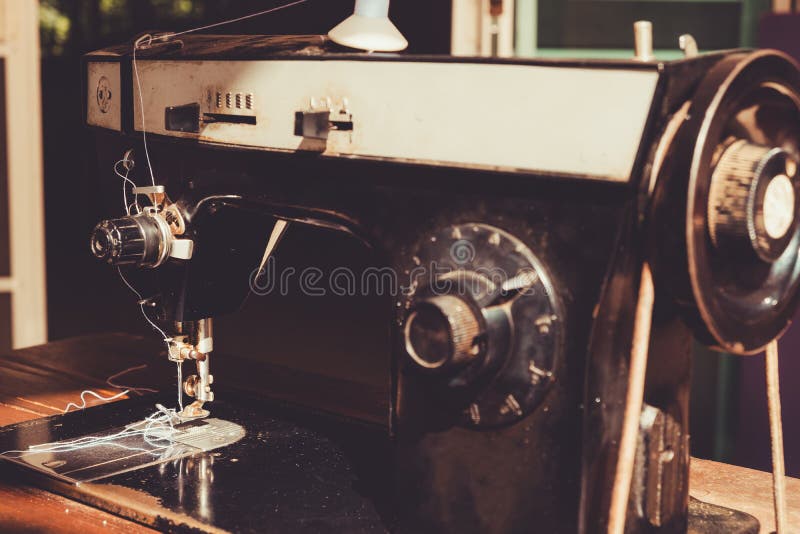 Old Sewing Machine in Workplace of Garment Factory. Stock Image - Image ...