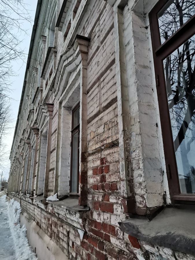 An Old Shabby Brick Building in Winter Stock Image - Image of building ...