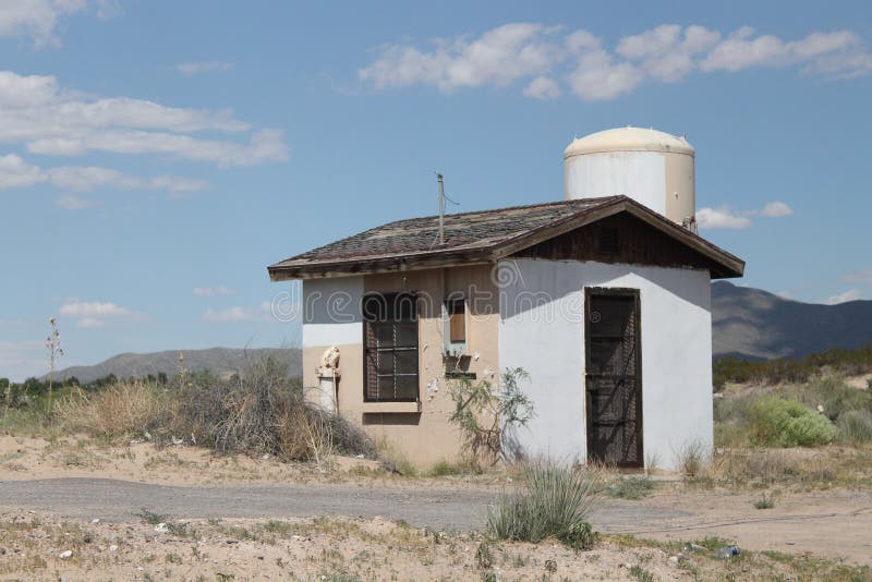 Old Shack on Roadside with Water Tower Stock Image - Image of water ...