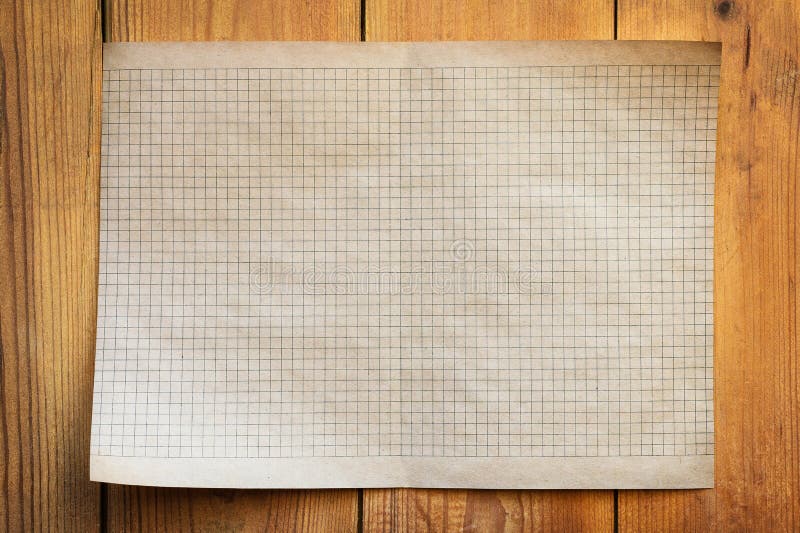 An Old Sheet of Squared Paper Lies on an Old Wooden Table. Stock Image ...