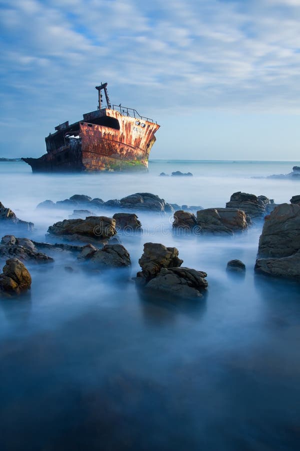 Old Shipwreck Long Exposure on Rocks at Sunset Stock Image - Image of ...