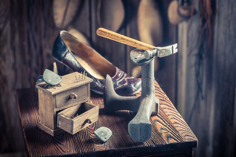 Old Shoemaker Workplace with Tools, Leather and Shoes Stock Photo ...