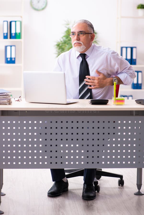 Old Sick Employee Suffering at Workplace Stock Image - Image of ...