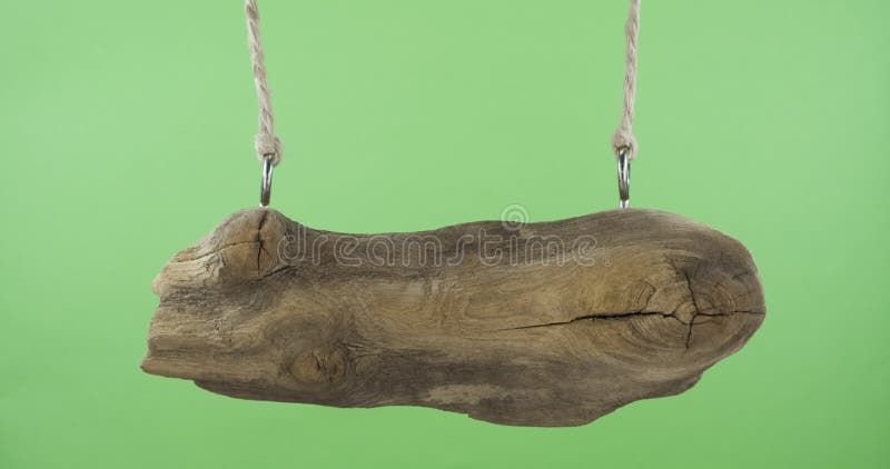 Old Sign is Swinging on the Ropes. Isolated on a Green Screen Stock ...